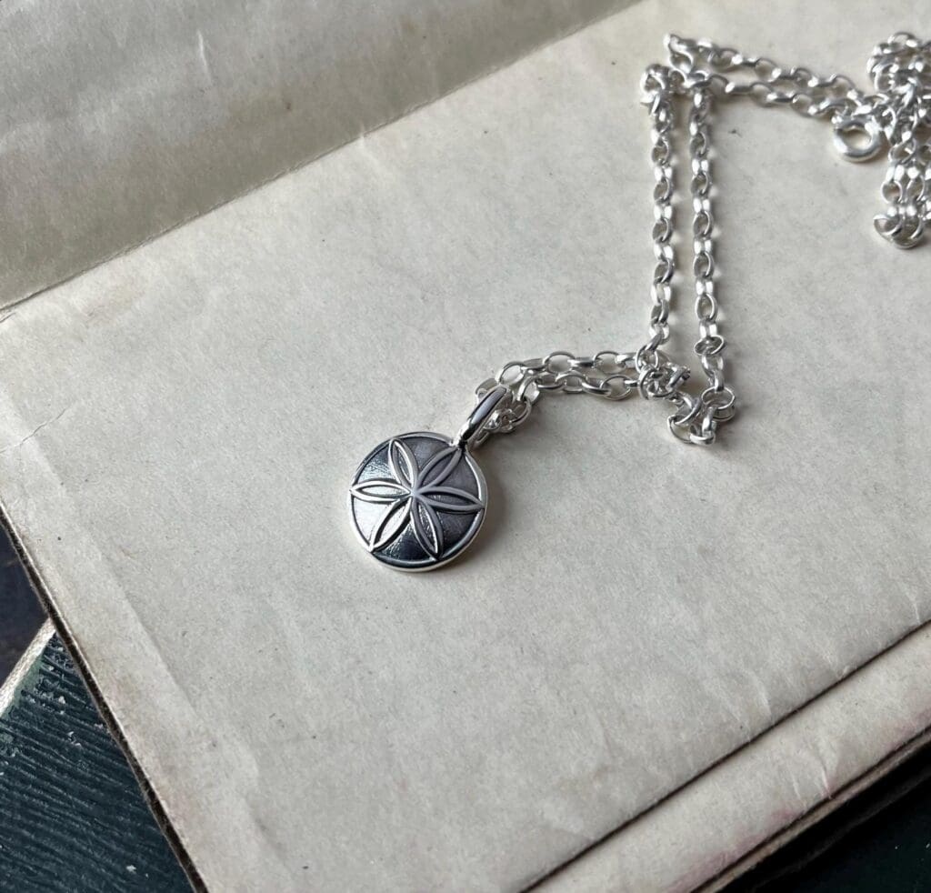 Daisy Wheel or Hexafoil pendant | The British Craft House